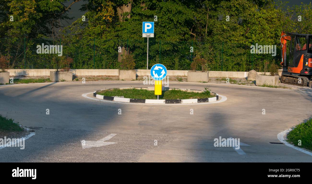 European roundabout under construction with industrial equipment in ...