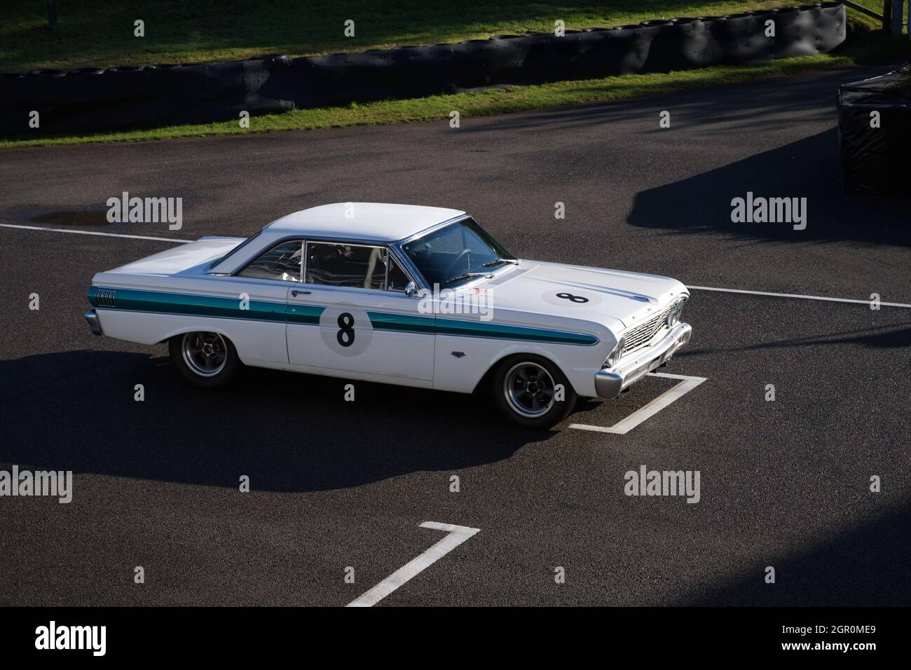 A Ford Falcon V8 muscle car in race trim on the grid at Goodwood Stock ...