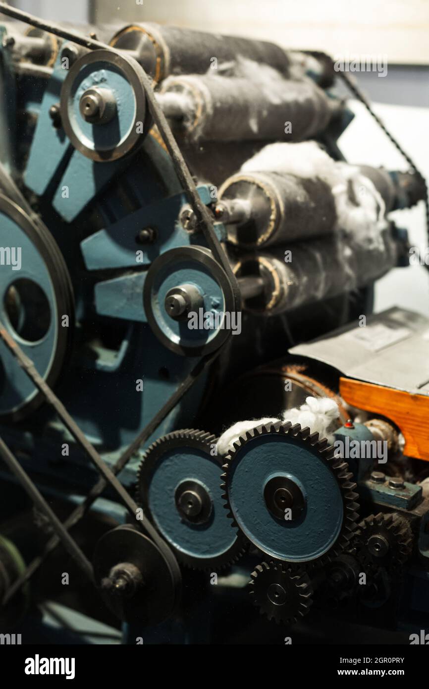 Close-up mechanism of a fabric making machine Stock Photo - Alamy