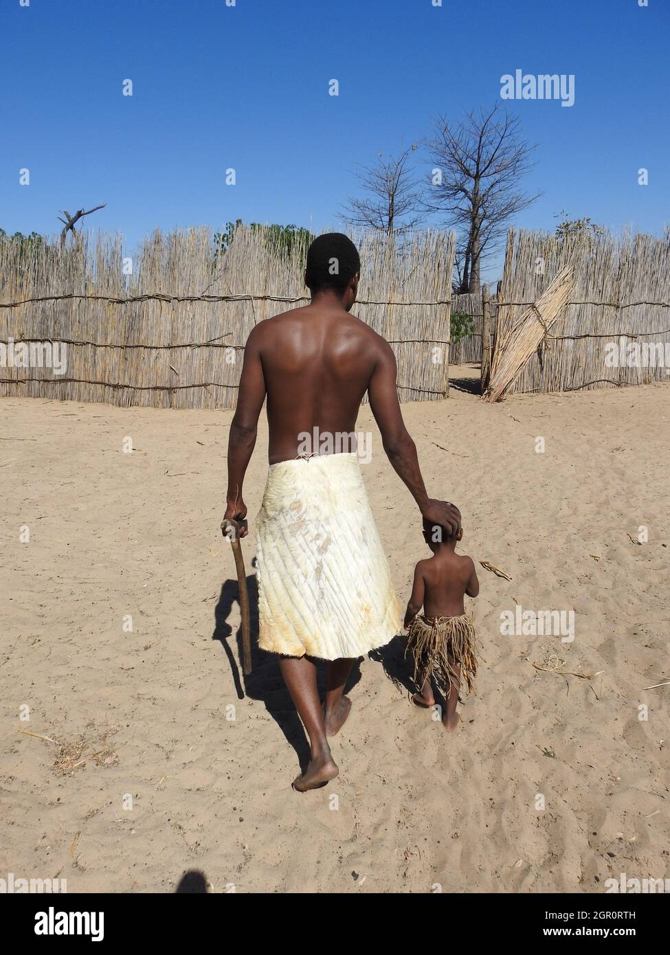 Horizontal shot of black-skinned male and child in African clothes ...