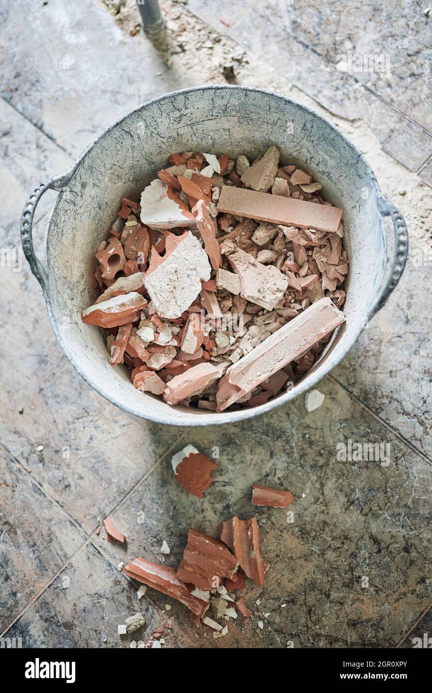 View from above of a bucket full of construction debris Stock Photo - Alamy