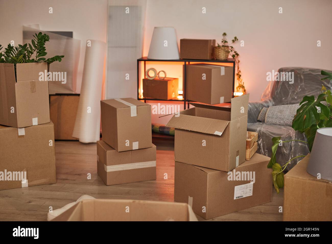 Background image of cardboard boxes in empty room moving in and ...