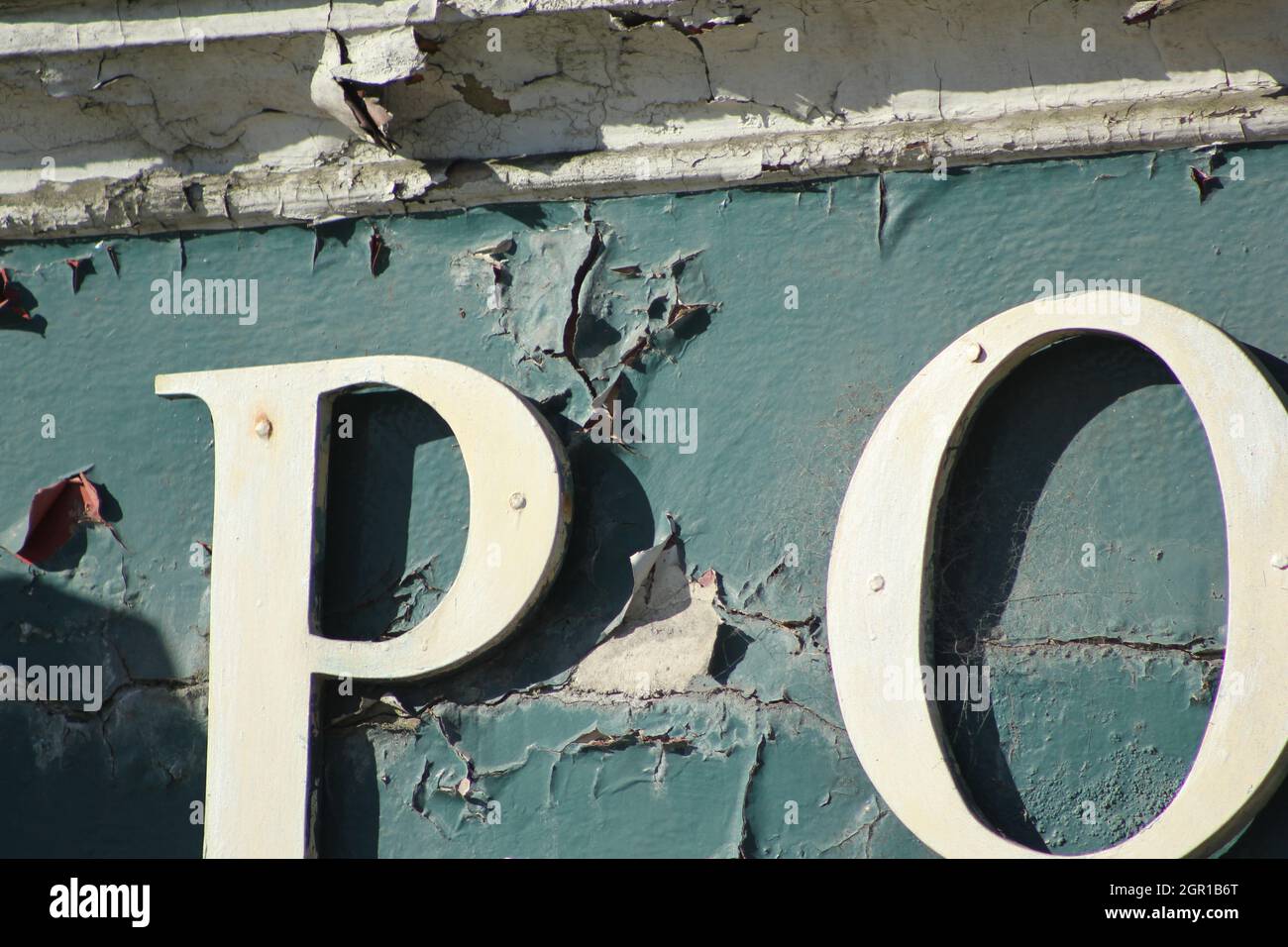 Peeling paint shop sign on wood Stock Photo - Alamy
