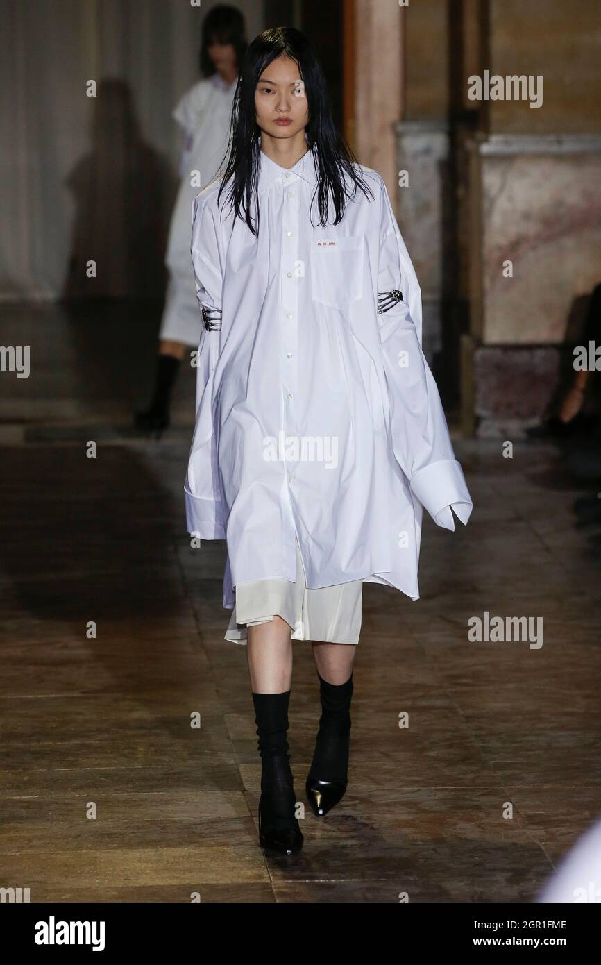 Model He Cong walks on the runway at the Raf Simons fashion show during ...