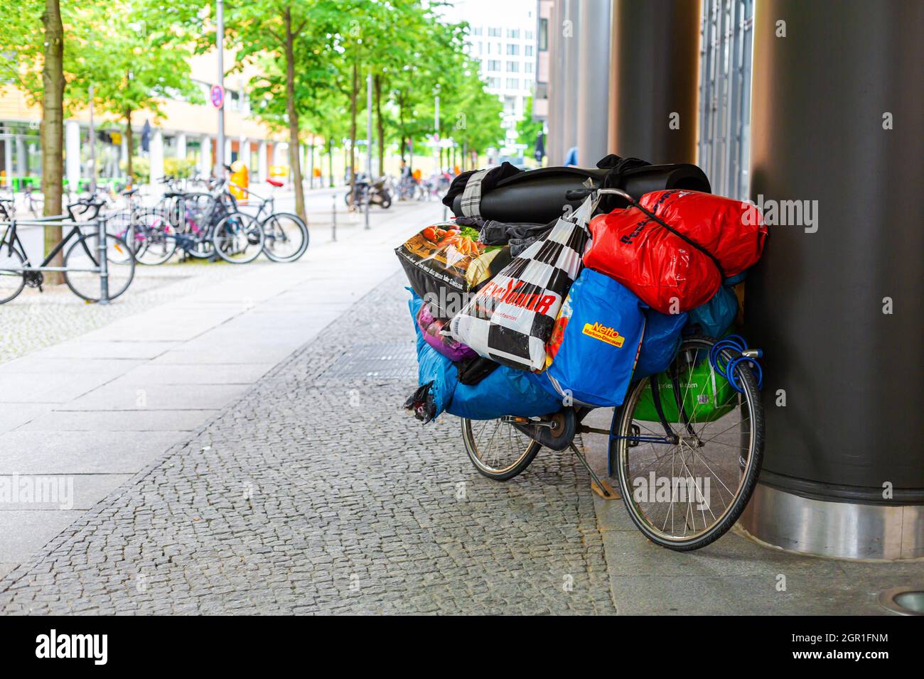 The bike of a homeless man who carries all his belongings on it. Berlin ...