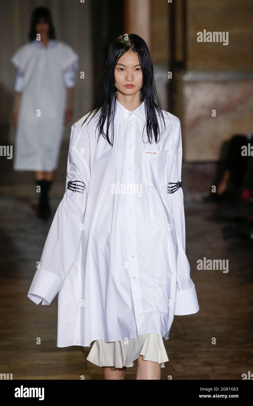 Model He Cong walks on the runway at the Raf Simons fashion show during ...