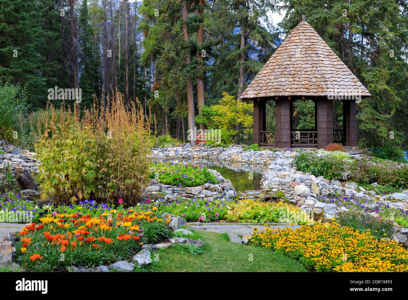 A wooden gazebo in a park in Banff National Park in the town of Banff ...