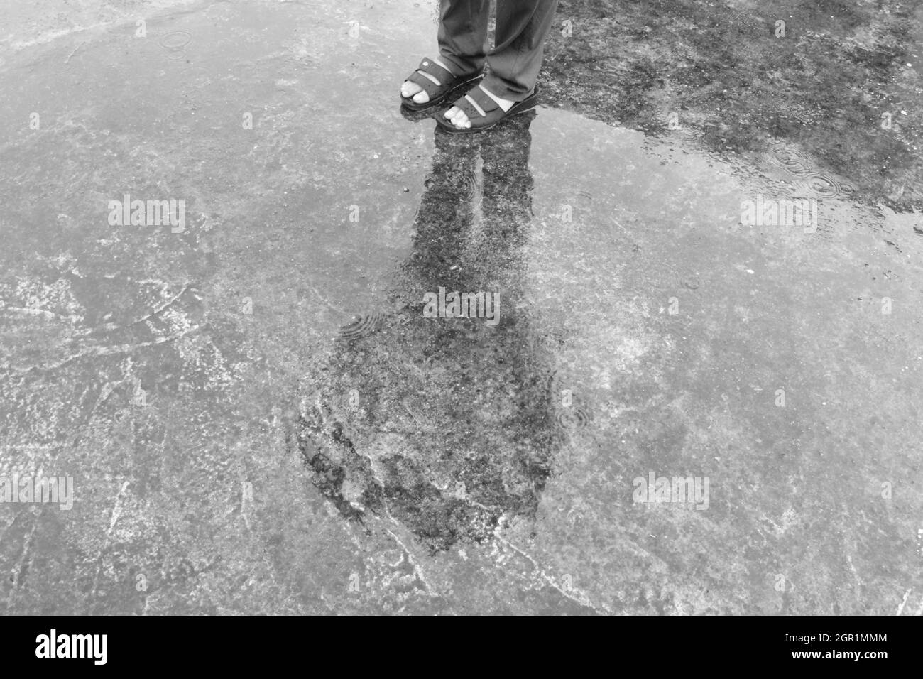 Man rain puddle Black and White Stock Photos & Images - Alamy