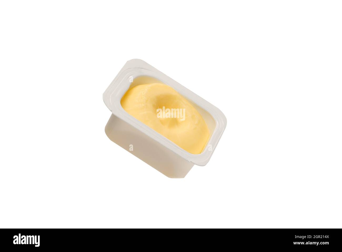 Closeup shot of a small container of butter isolated on white ...