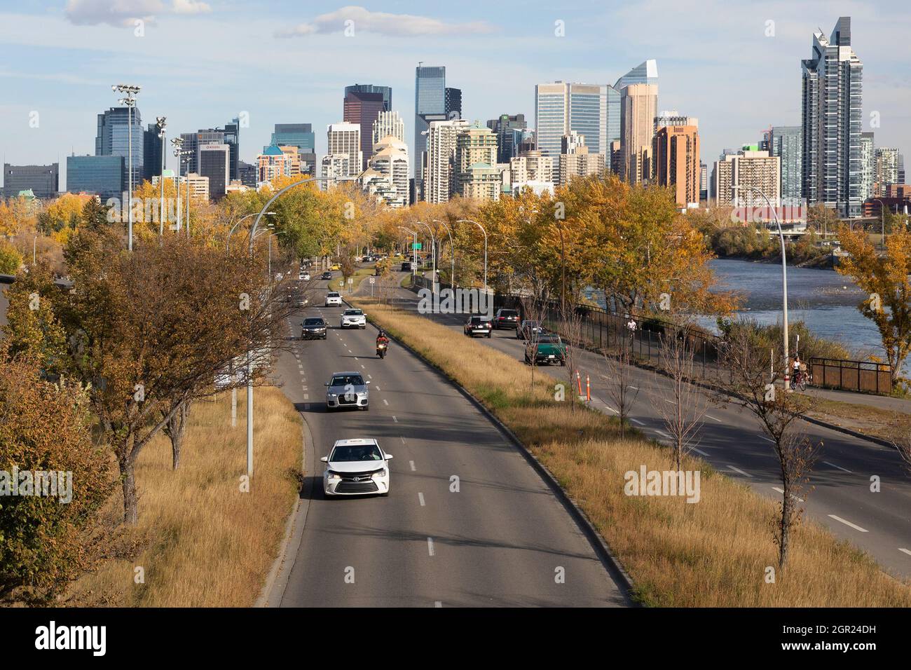 Traffic driving on Memorial Drive along the Bow River leaving Calgary ...