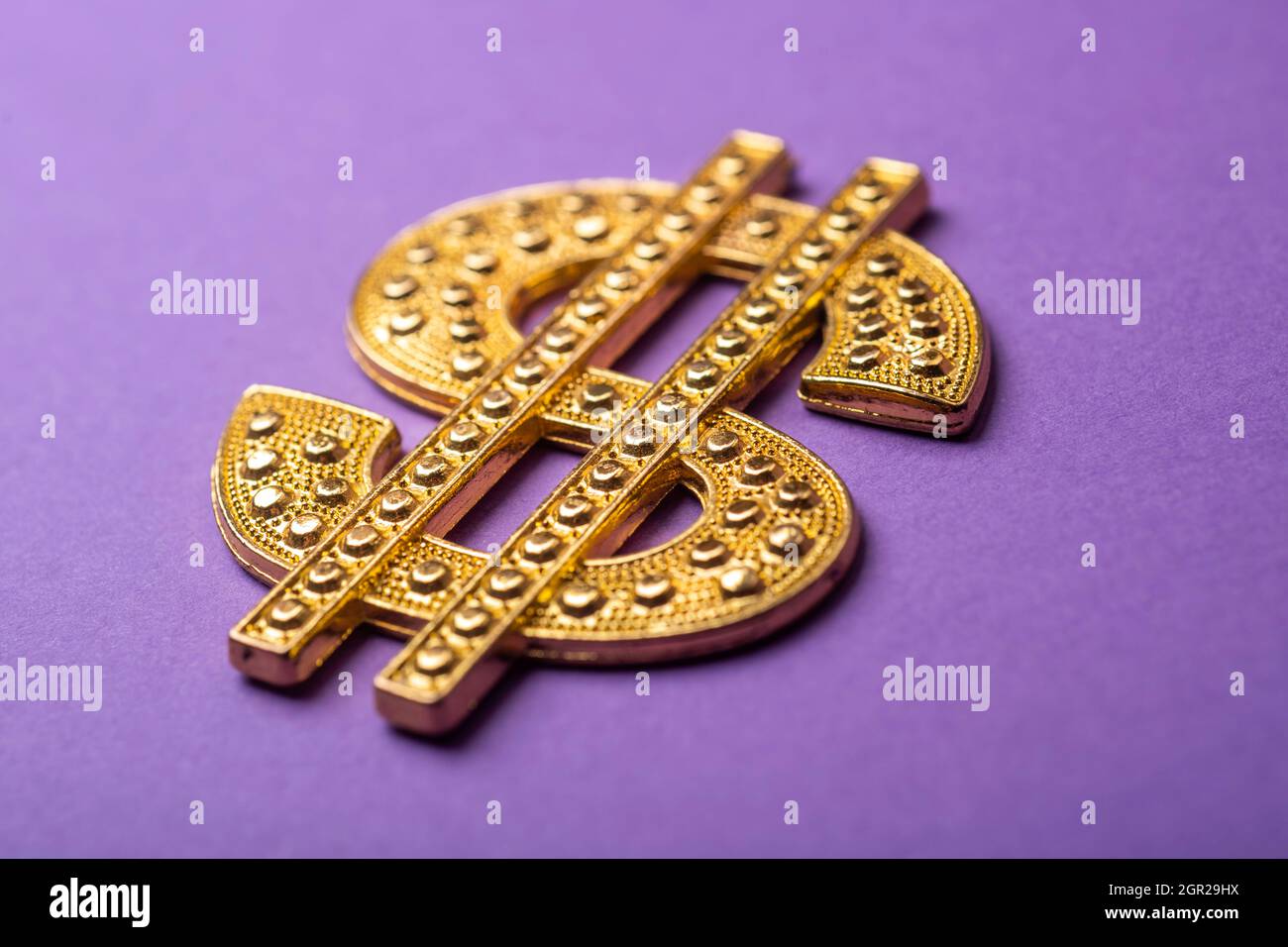 A gold metal dollar sign Stock Photo - Alamy