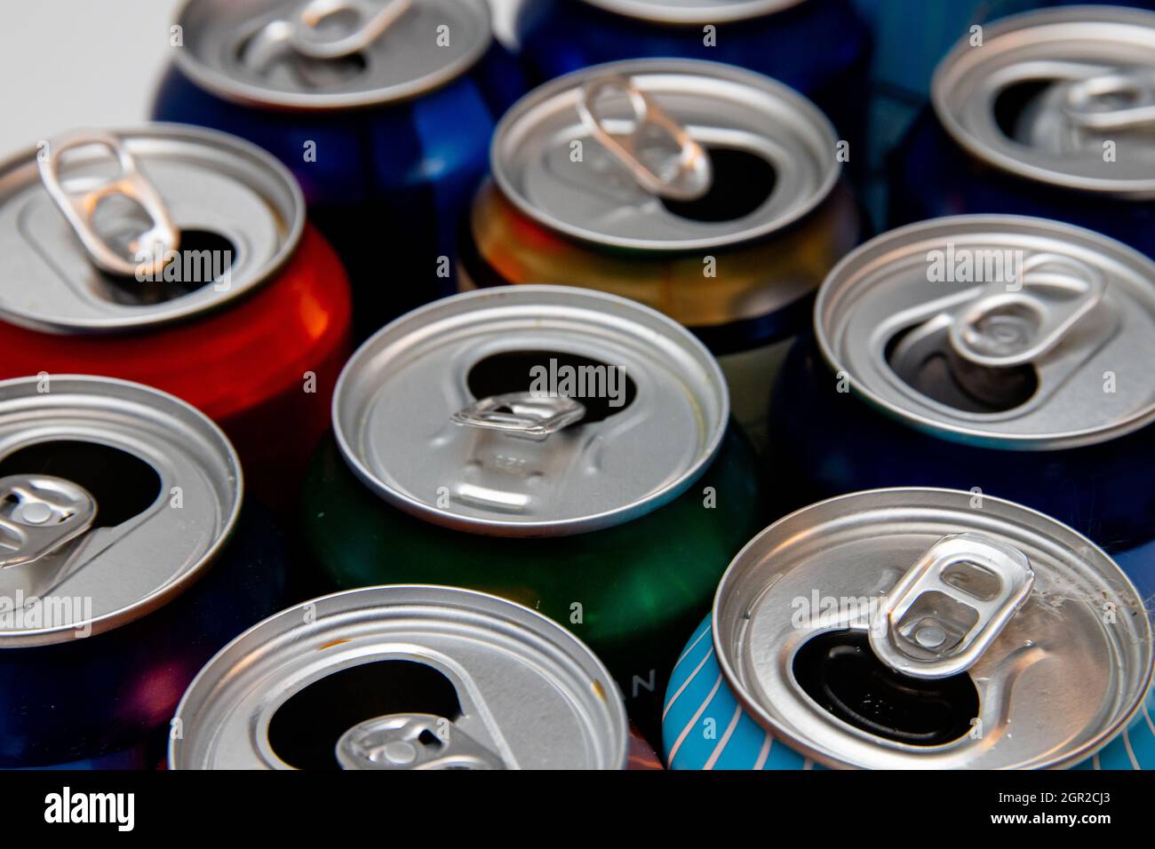 Top view shot of colorful cans on a white surface Stock Photo - Alamy