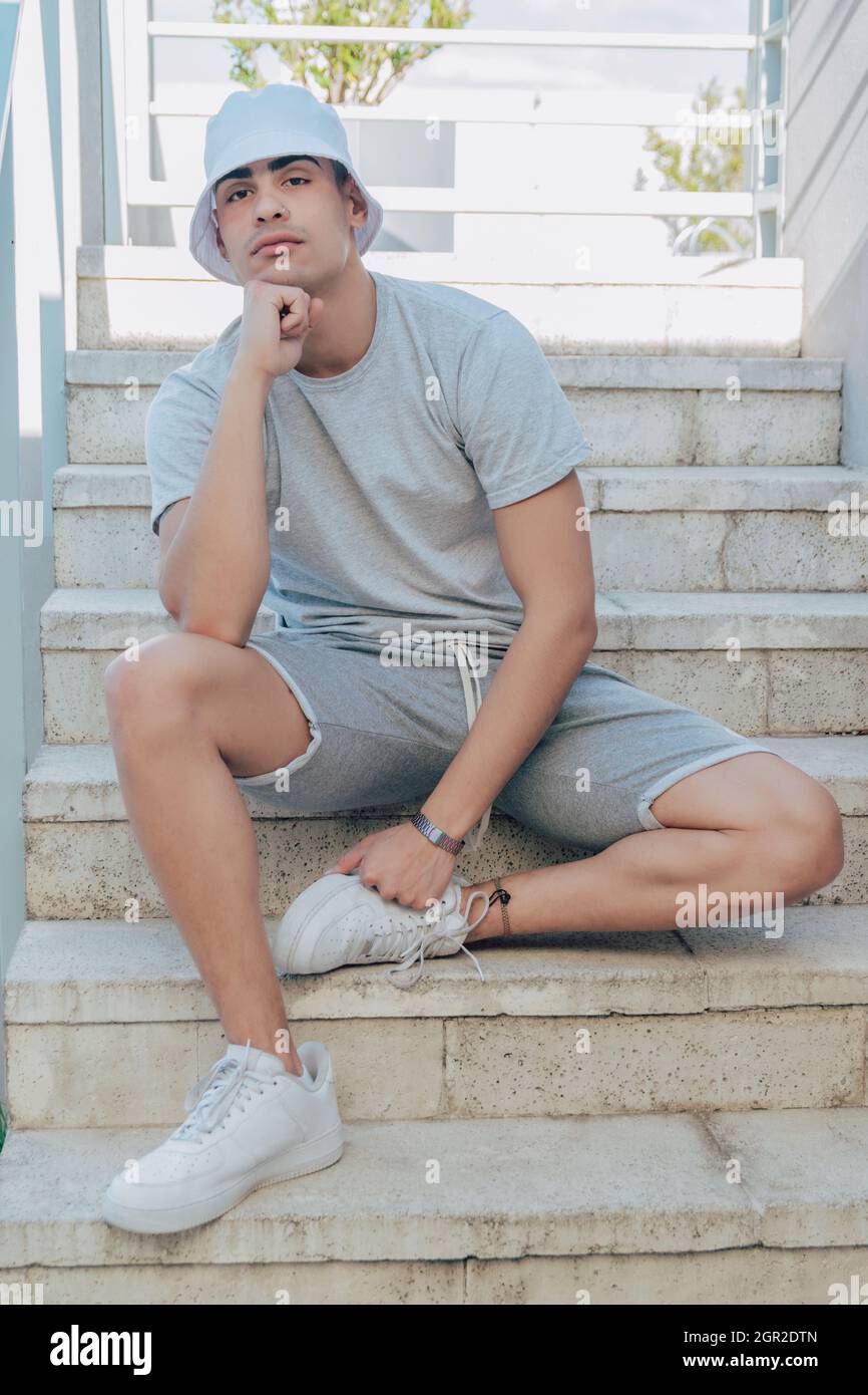 Boy sitting on stoop hi-res stock photography and images - Alamy