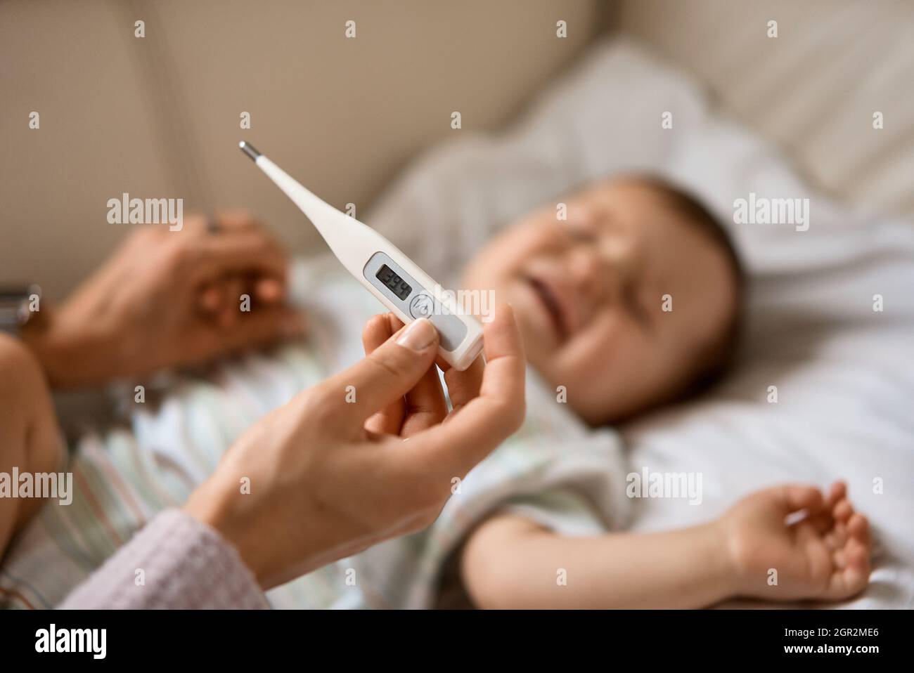 The little boy cry because of the high temperature. First year of life ...