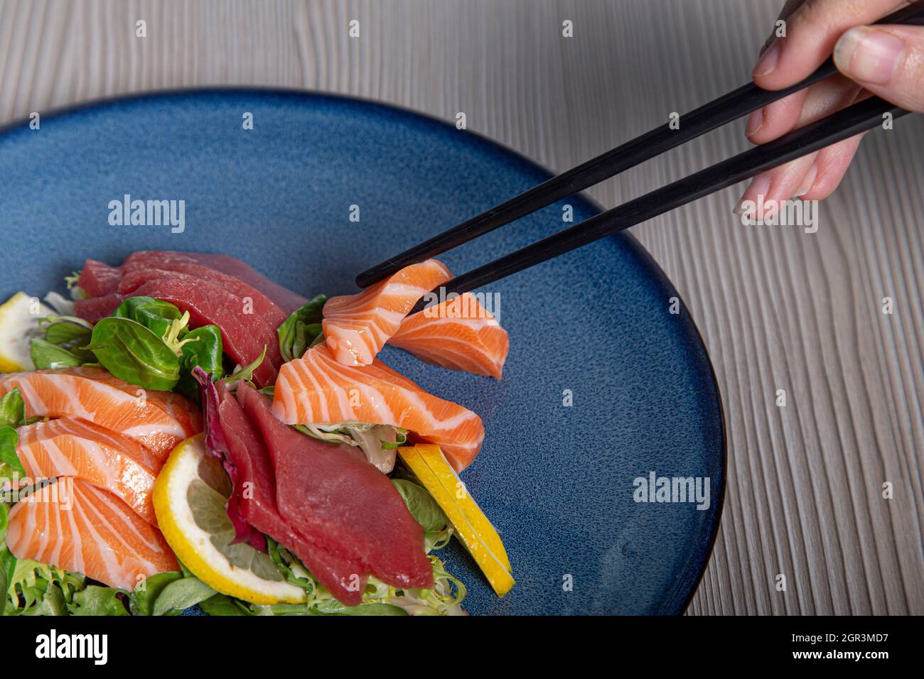 Eat Sashimi With Closed Chopsticks. Raw Fish. Isolated Image With Copy ...