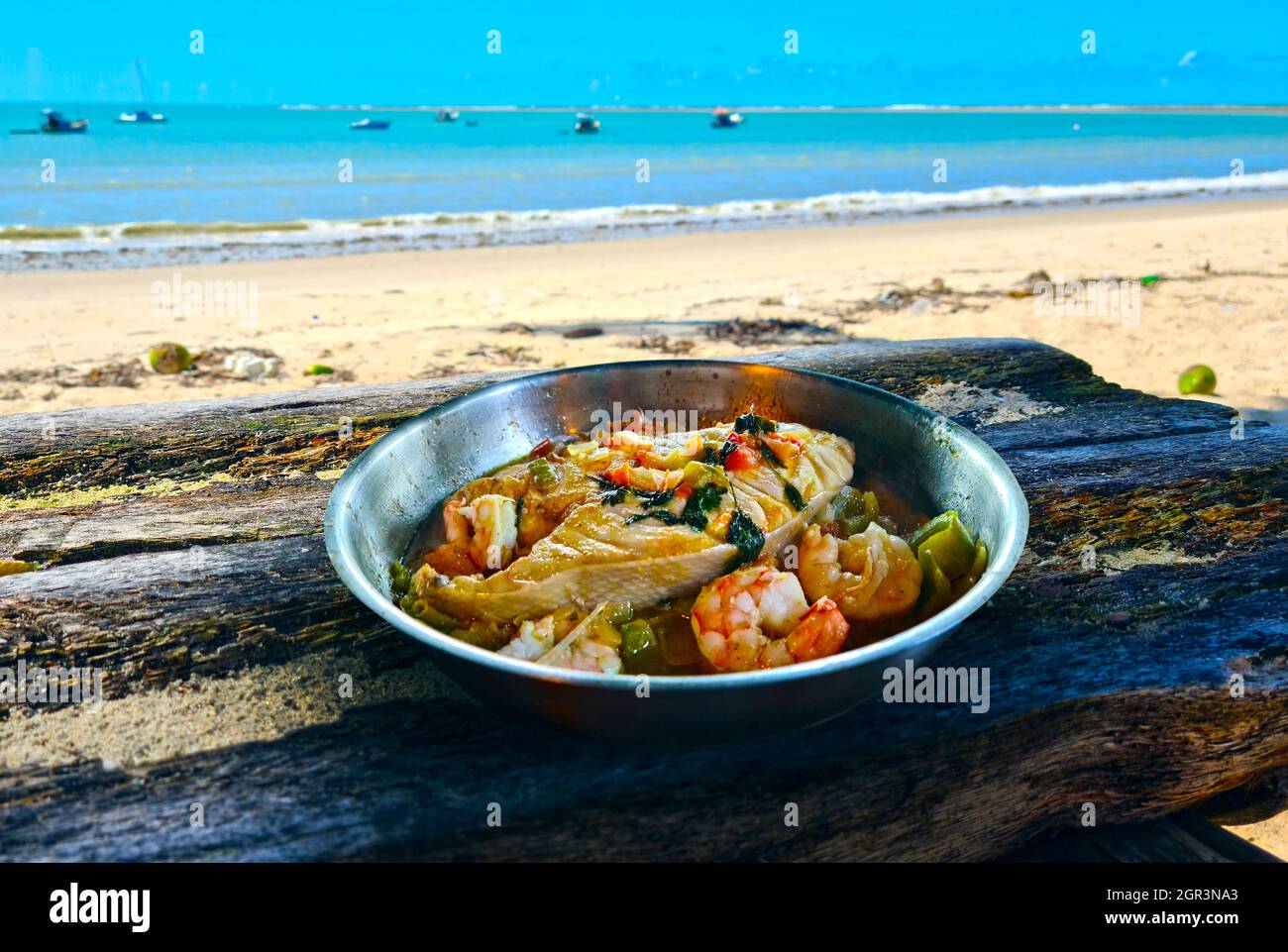 Moqueca, a traditional Brazilian dish with badejo fish and large shrimp ...