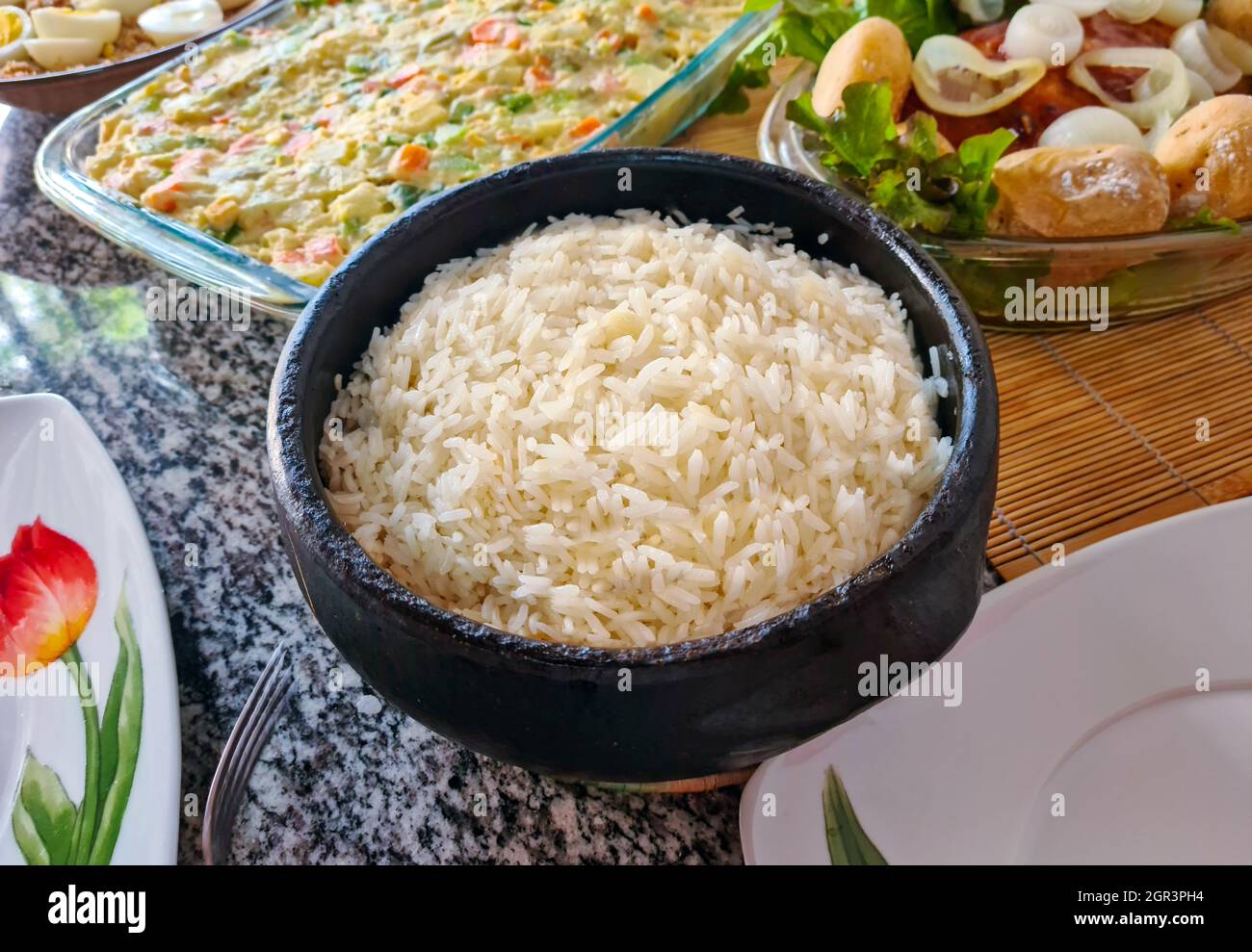 White rice cooked with garnishes Stock Photo - Alamy
