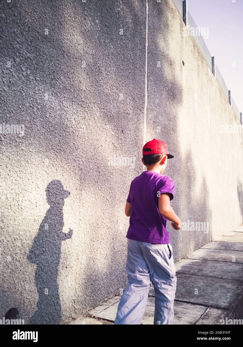 Young Boy Runs At The Apartment Area In The Morning Stock Photo - Alamy