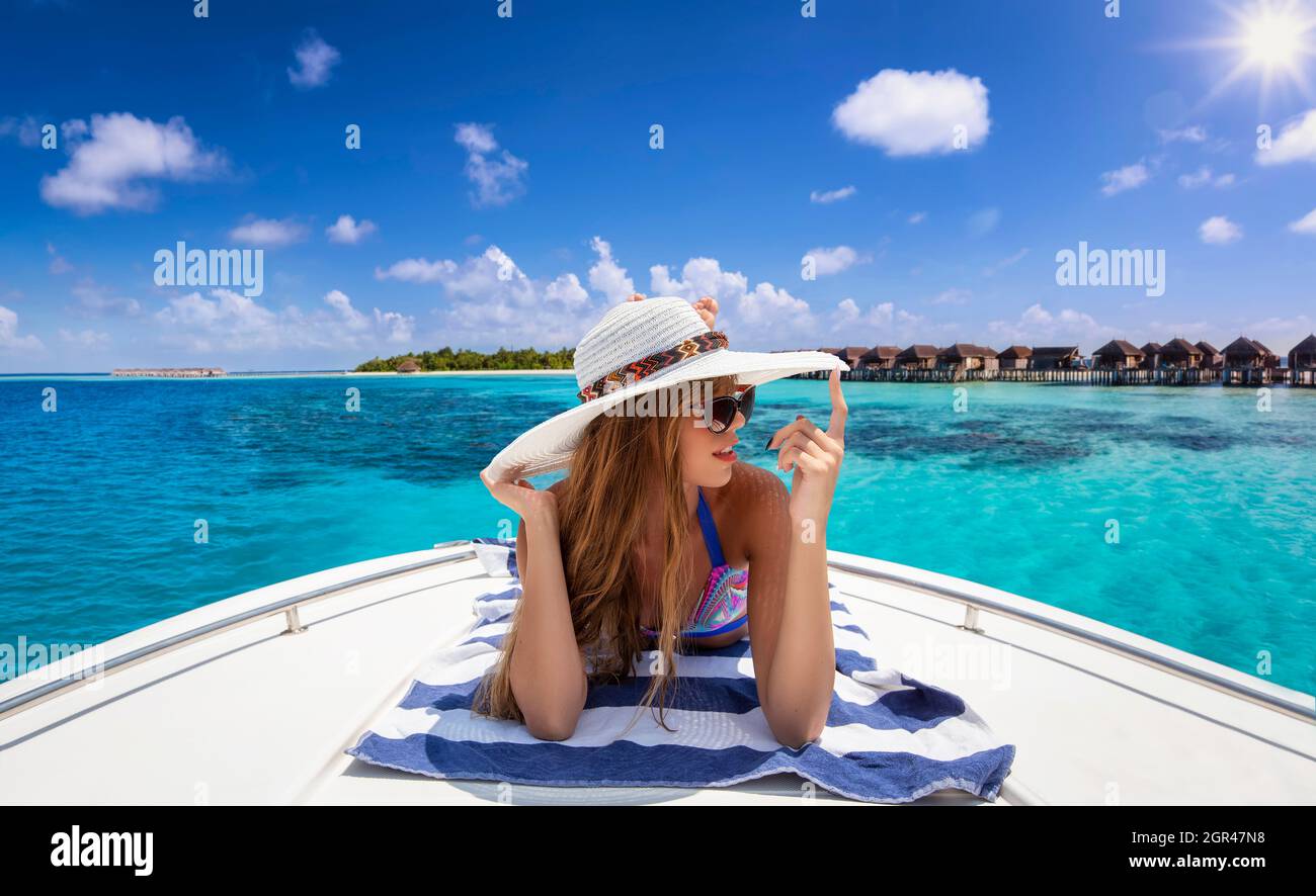 Woman lying on deck yacht hi-res stock photography and images - Alamy