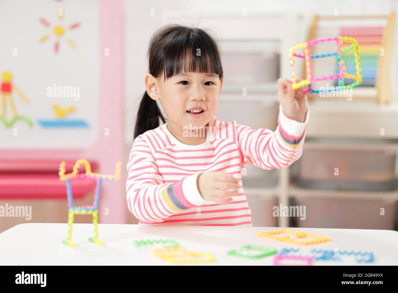 Young Girl Playing Creative 3d Shape Toy For Homeschooling Stock Photo ...