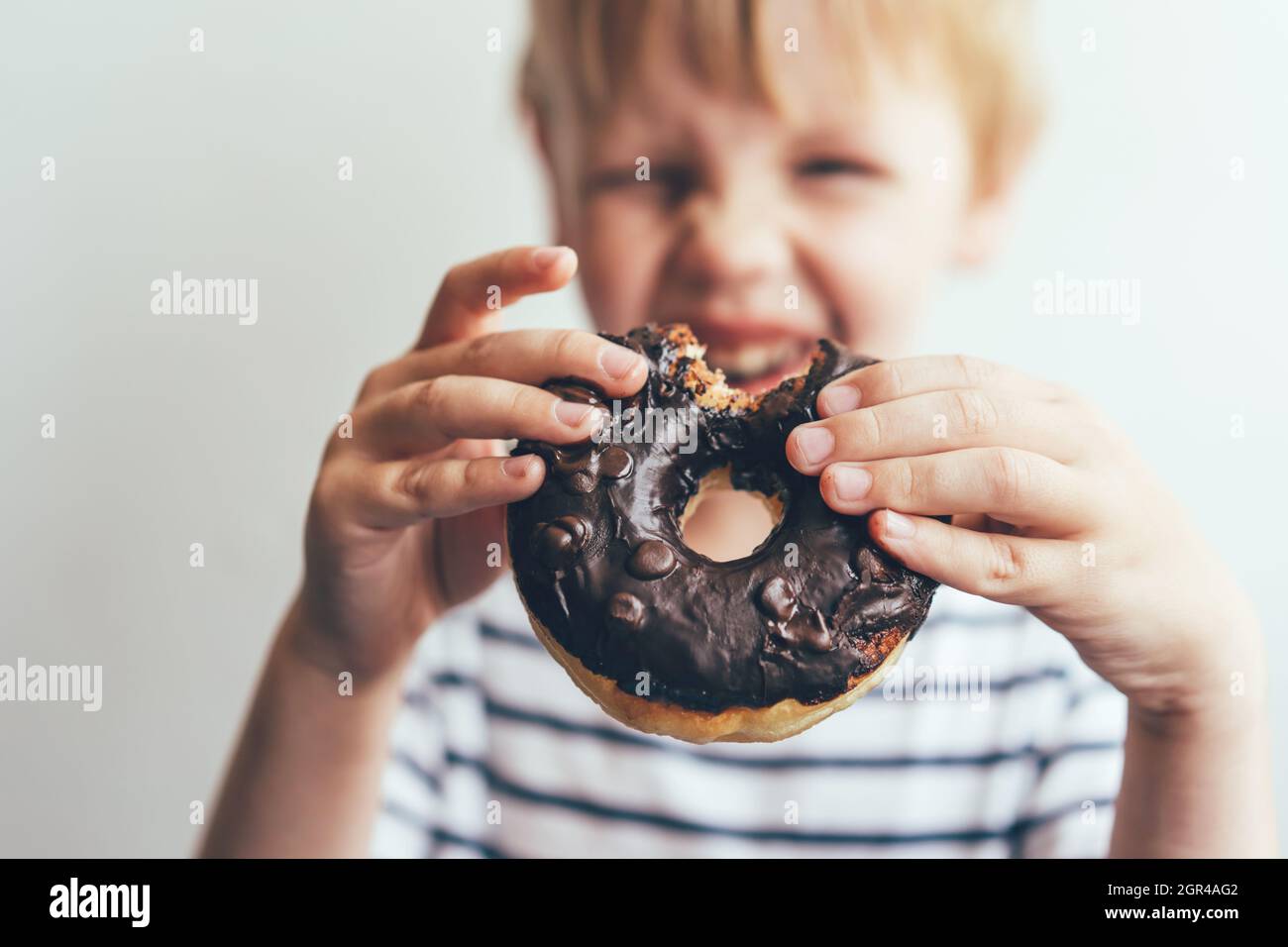 Hand holding donut eating bitten food hi-res stock photography and ...