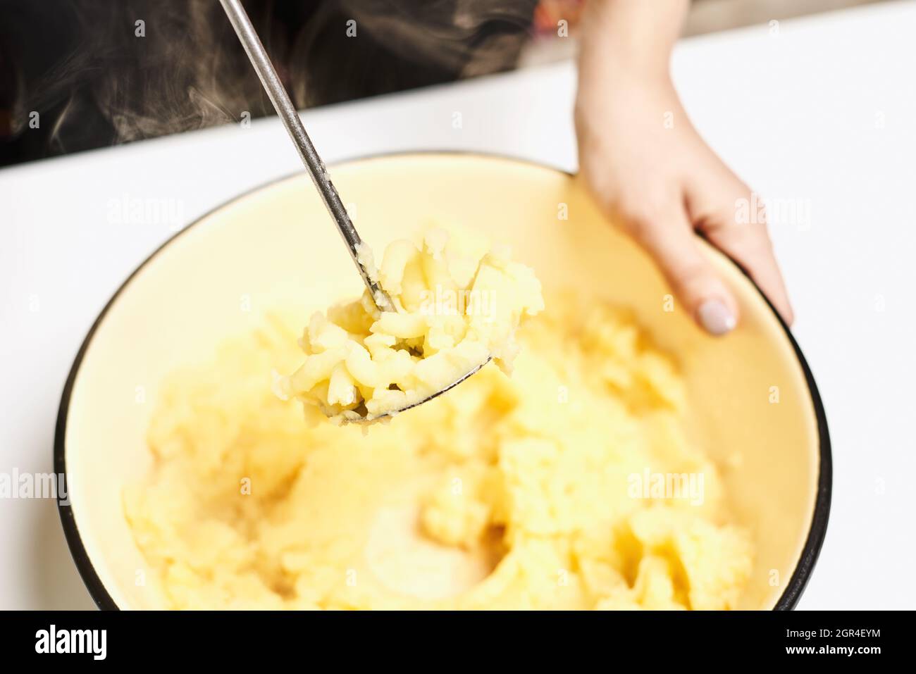 Mashing potato hi-res stock photography and images - Alamy