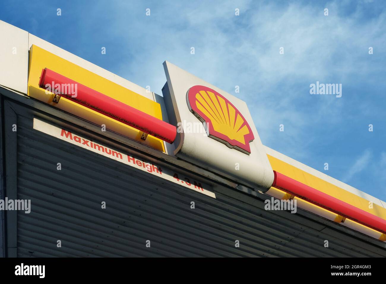 London, UK. The bright yellow and red logo at a Shell petrol station ...