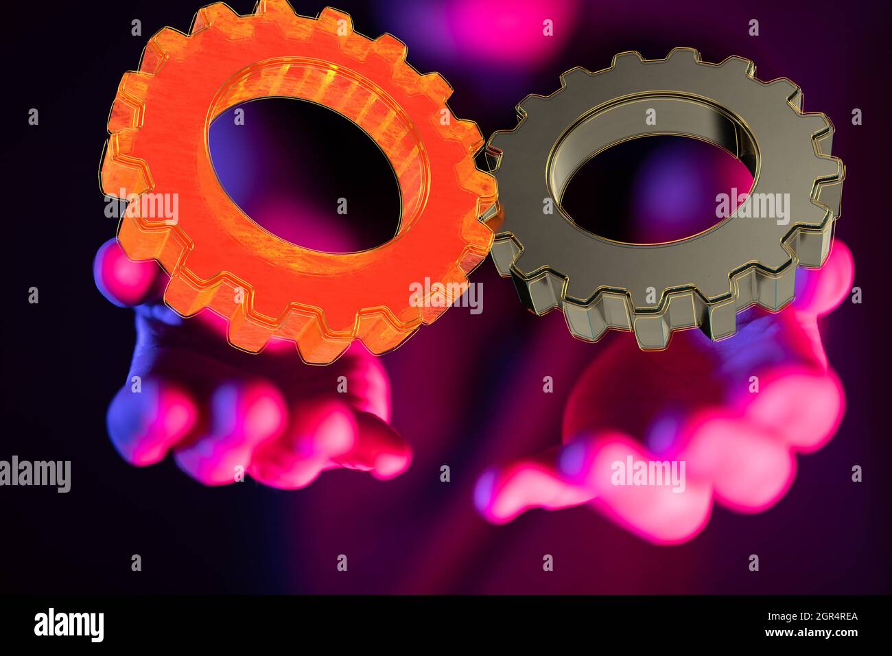 Gears over male hands Stock Photo - Alamy