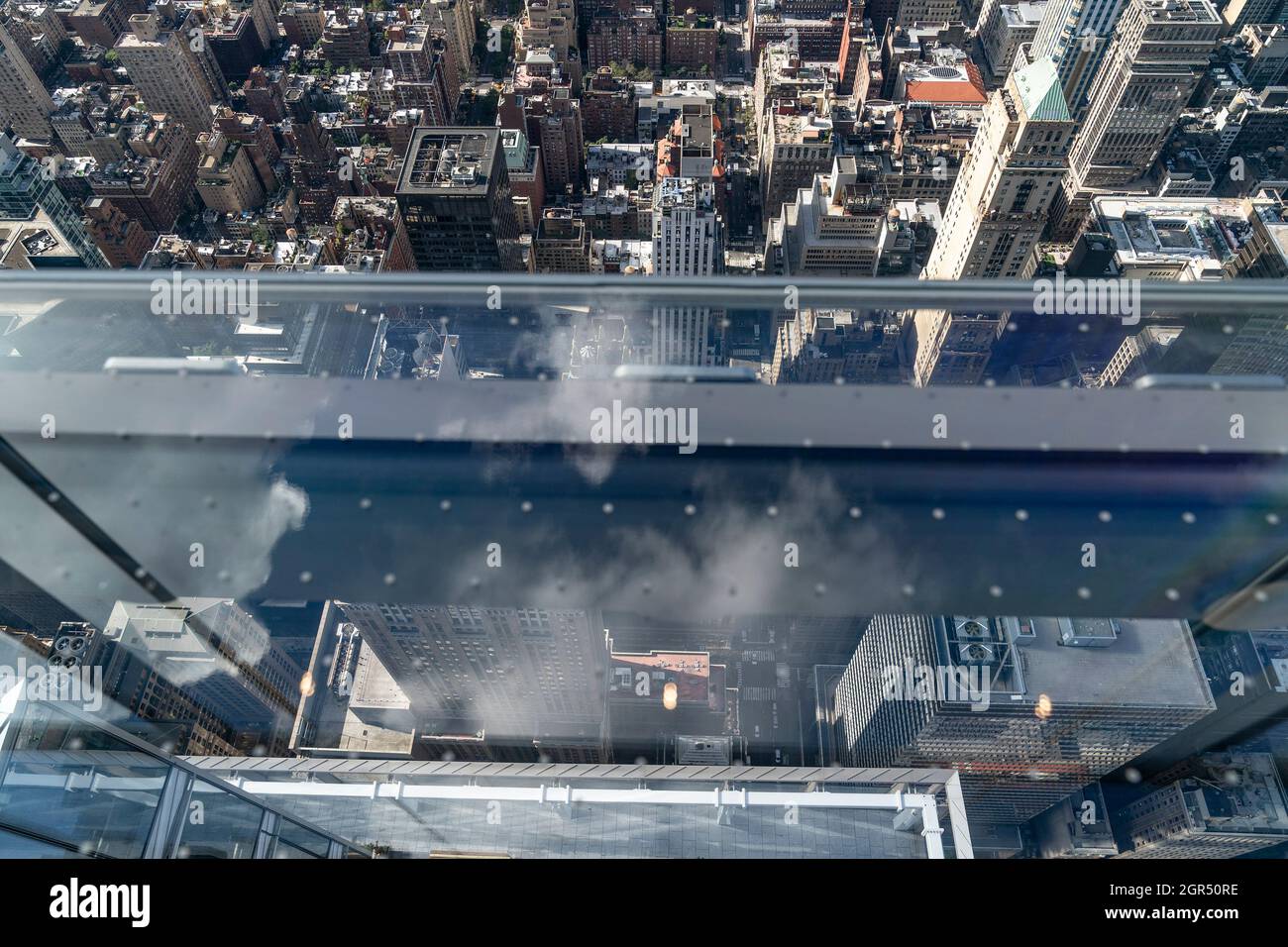 View of the city from observation deck Summit (through glass floor of ...