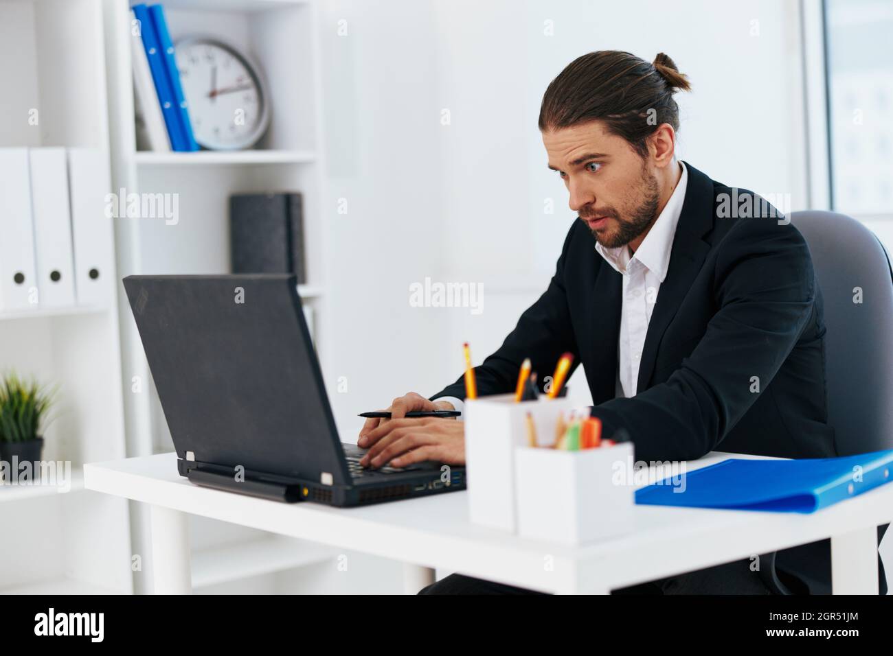 manager work in front of laptop emotions boss Stock Photo - Alamy