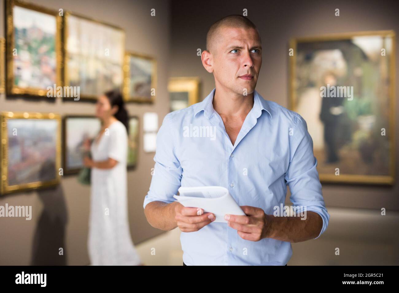 Portrait of man in gallery Stock Photo - Alamy