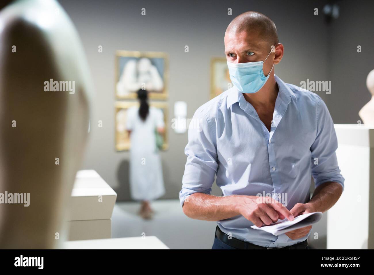 Adult man in museum Stock Photo - Alamy