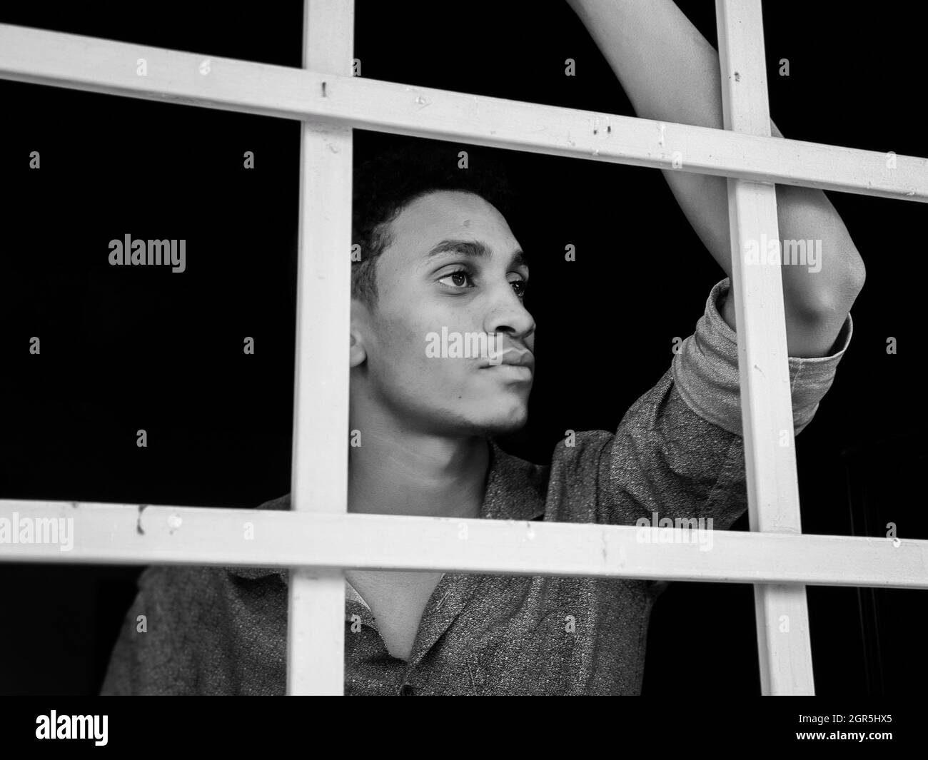 Young men with handcuffs hi-res stock photography and images - Alamy