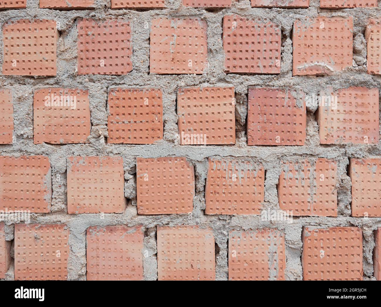 Closeup of brick wall with cement filling Stock Photo - Alamy