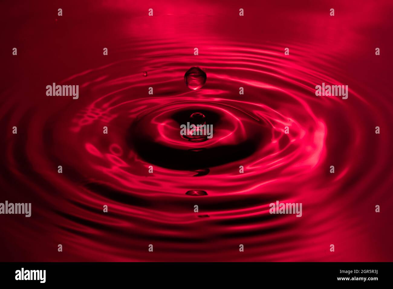 Closeup of water drop splash under the red lights - perfect for ...