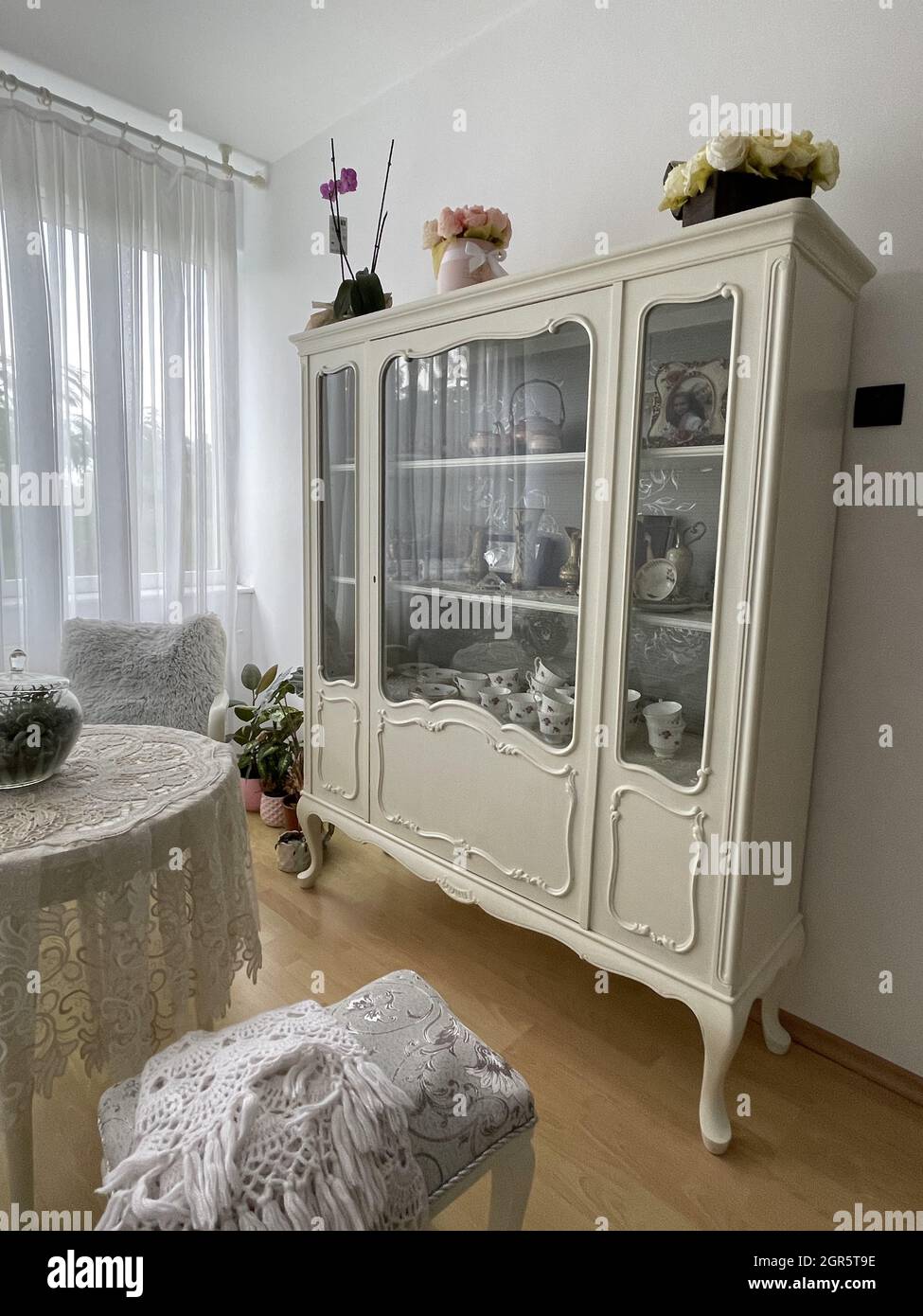 Vertical shot of a luxurious white cupboard in a room of a modern ...