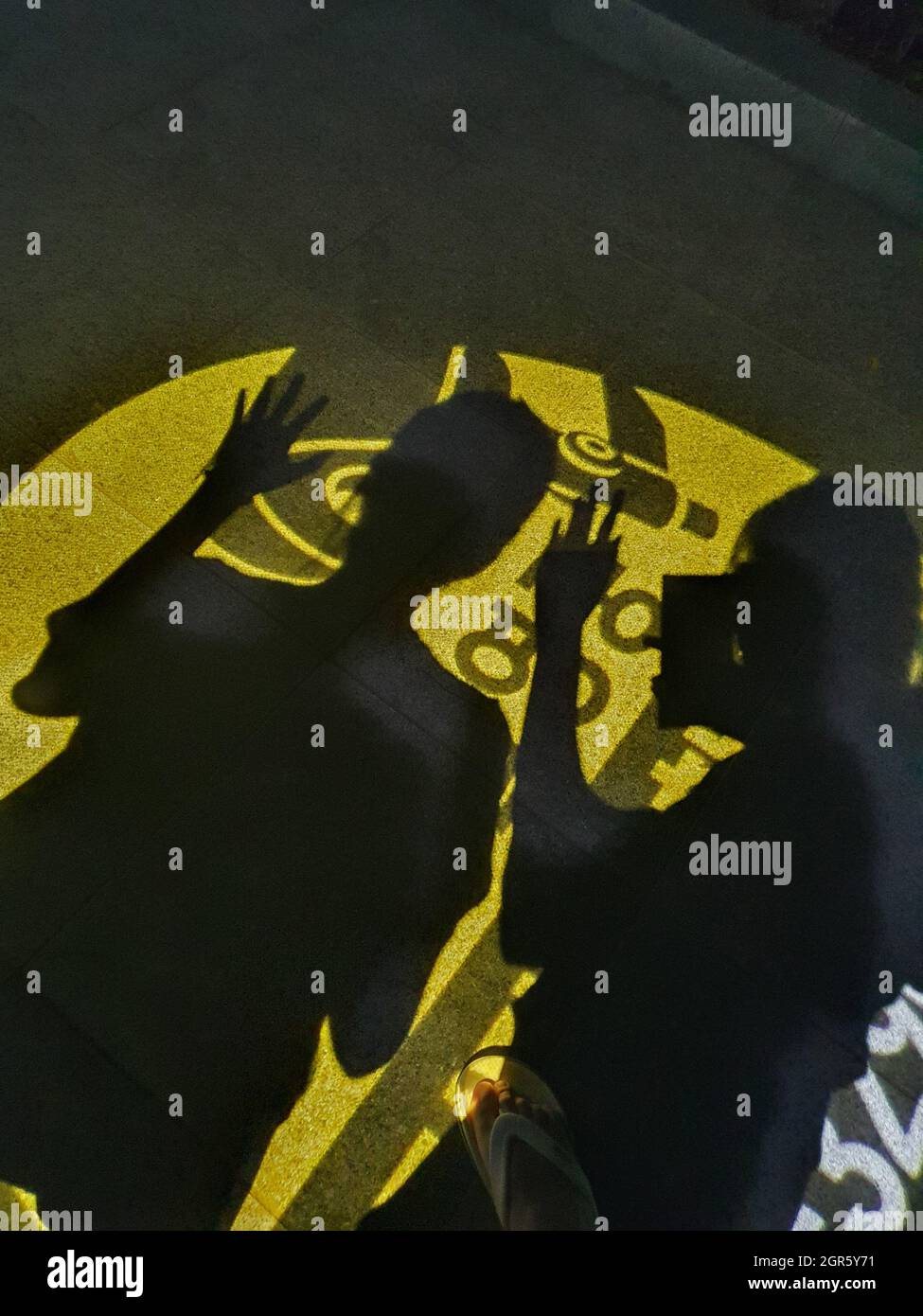 Closeup of a shadow of posing youngsters Stock Photo - Alamy