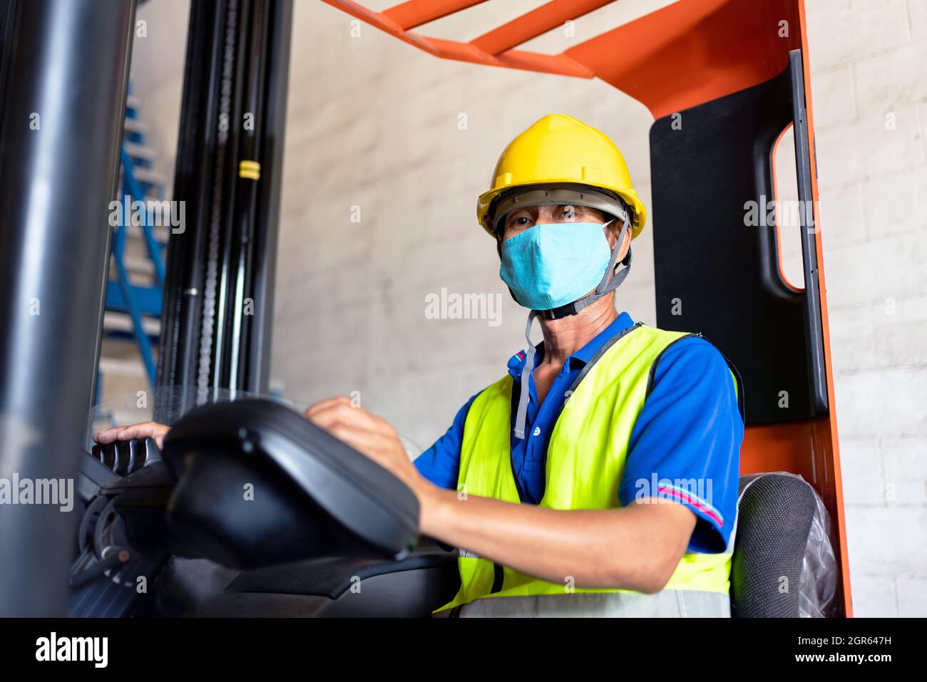 Indian construction worker wearing mask hi-res stock photography and ...