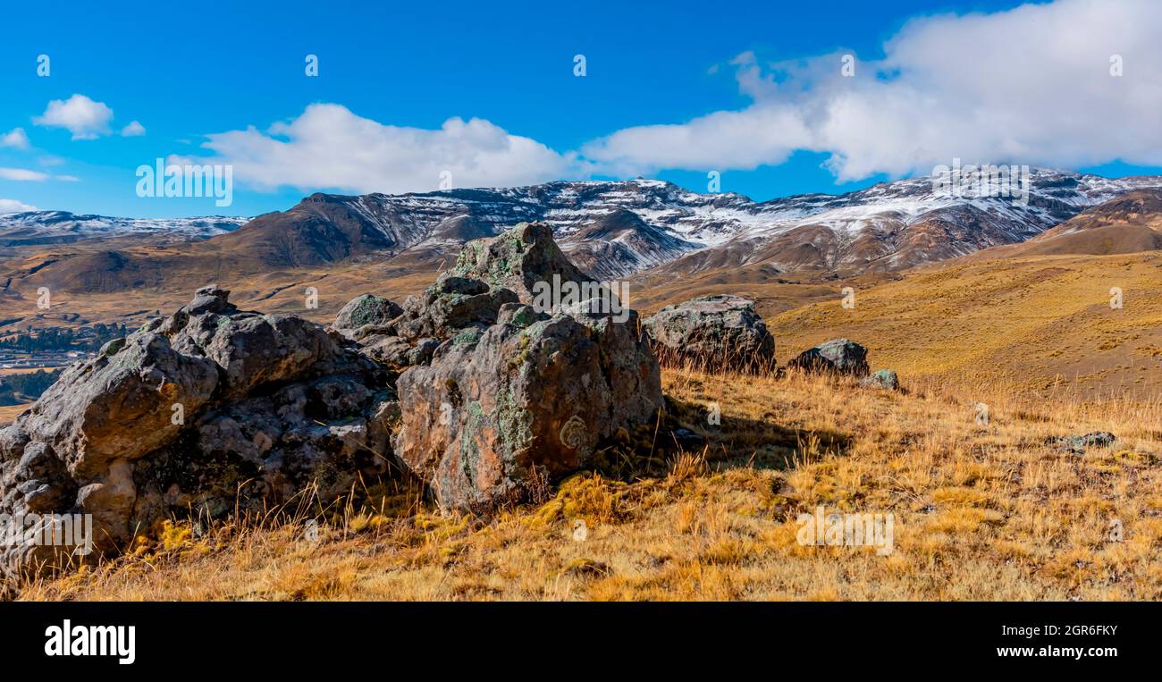 Watching the sunrise on a sunny day with few clouds near the Andes of ...