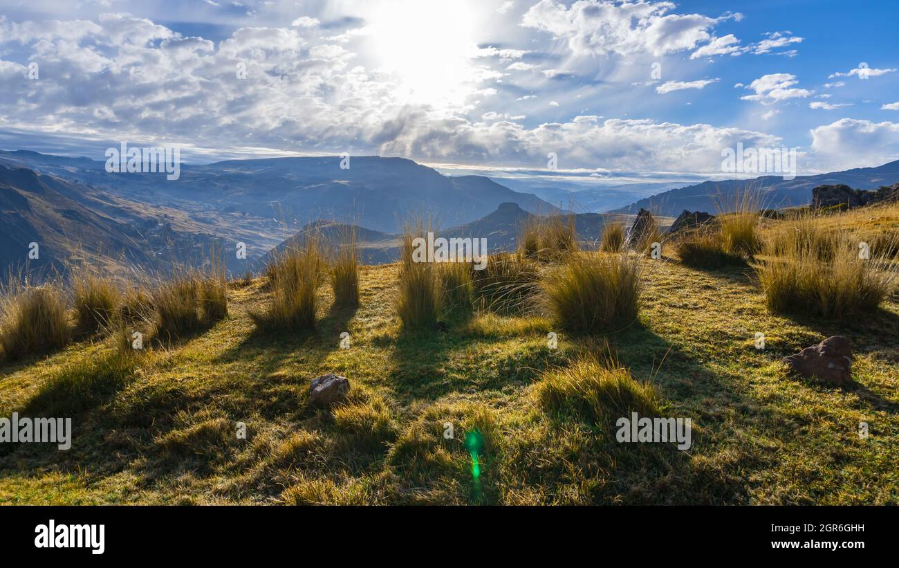 Watching the sunrise on a sunny day with few clouds near the Andes of ...