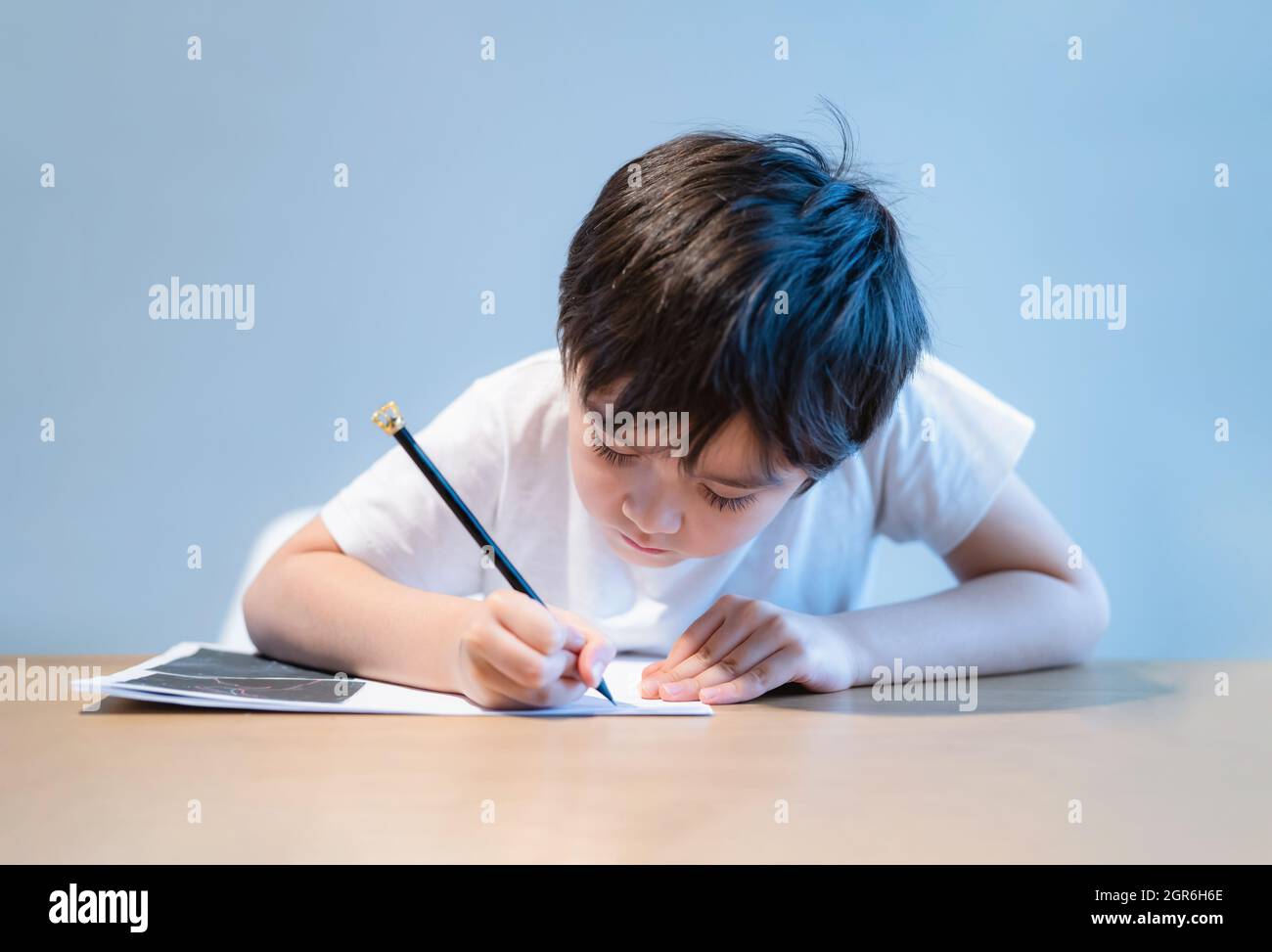 Cute Boy Studying At Home Stock Photo - Alamy