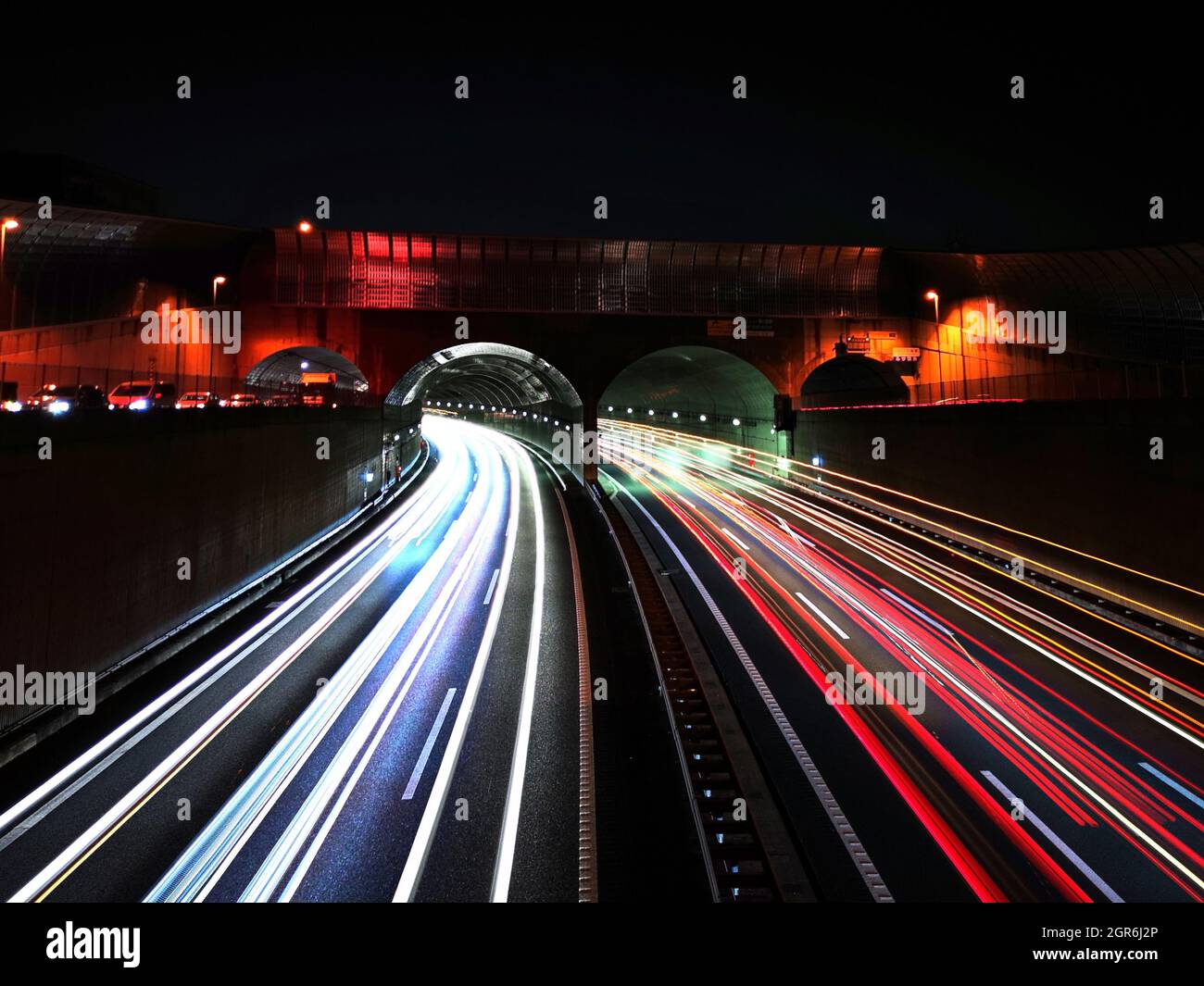 Light Trails On Bridge In City At Night Stock Photo - Alamy