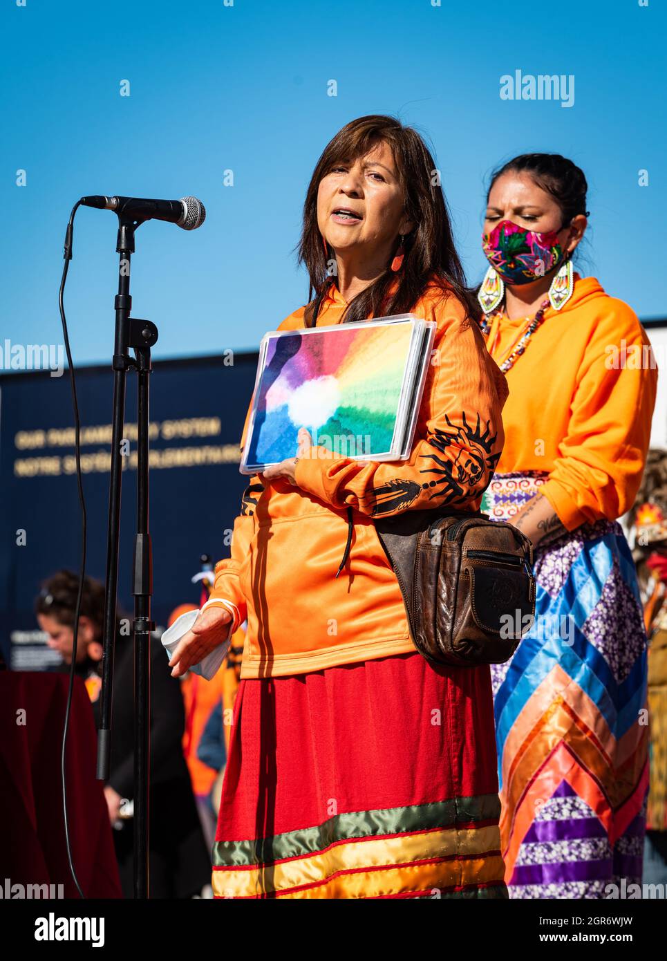 Teresa Bear Fox and an Awkwasasne Women's Singer perform a tribal song ...