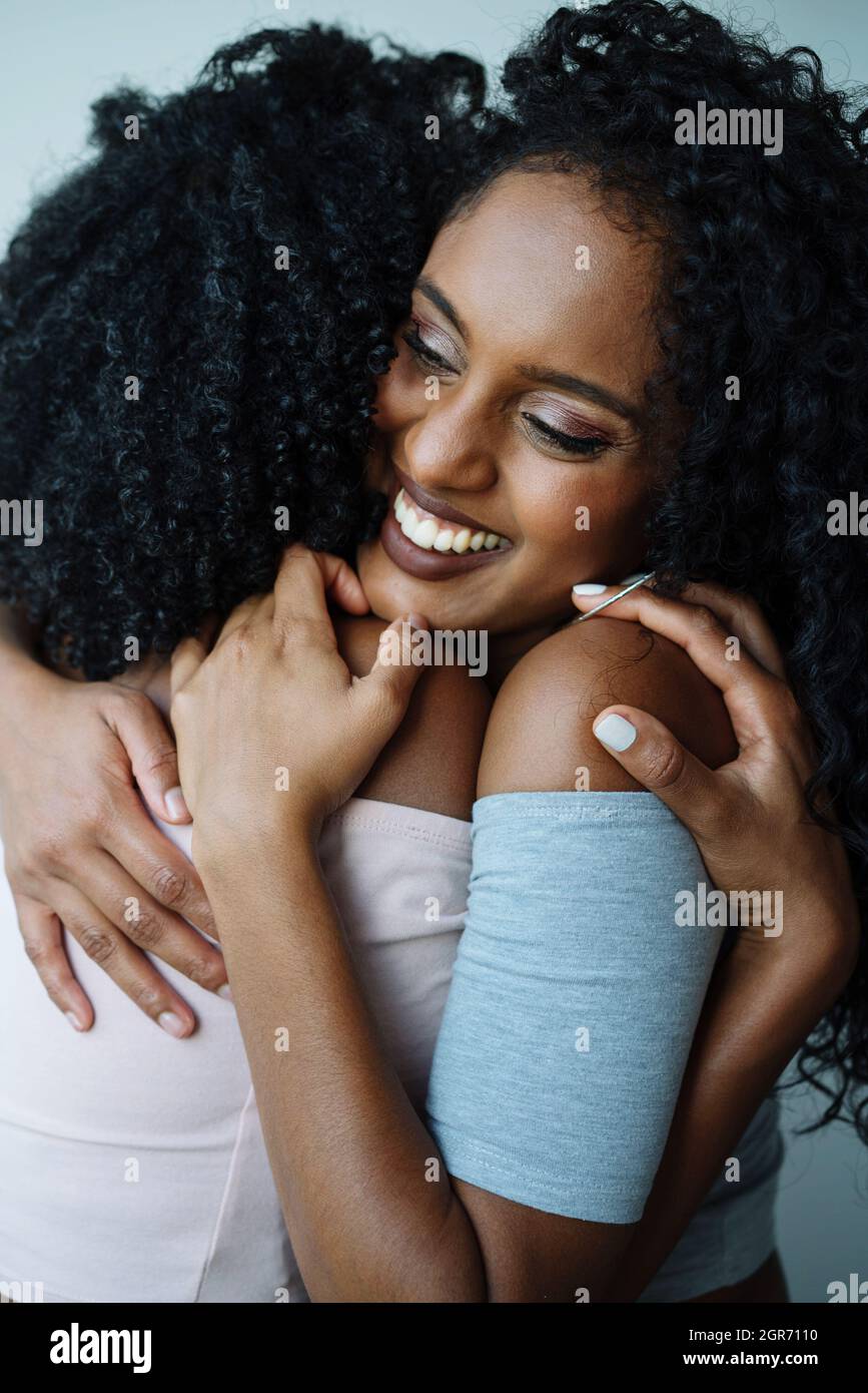 Two Black Women Hugging Each Other High Resolution Stock Photography ...