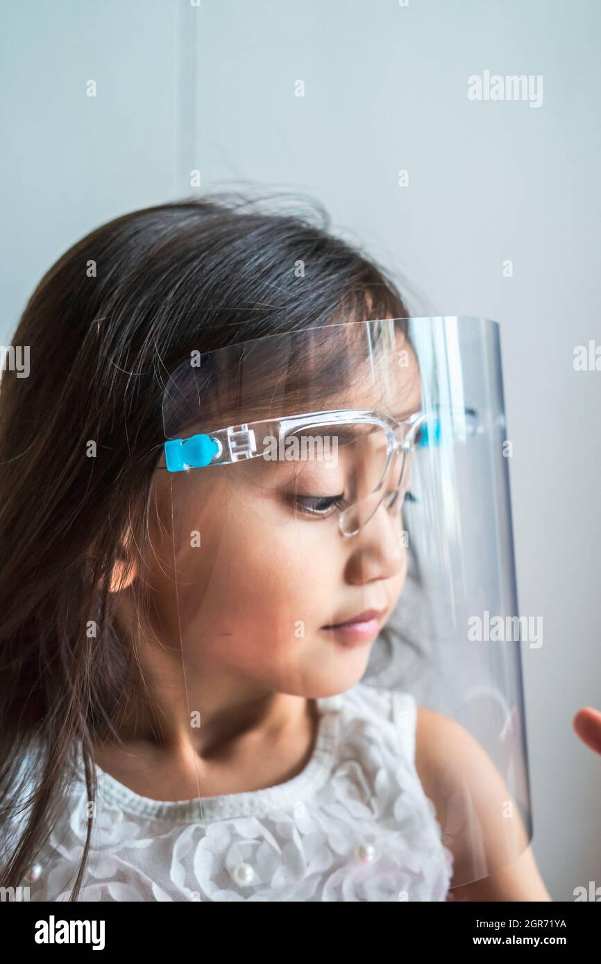 Girl girls looking wearing face mask masks covid 19 hi-res stock ...