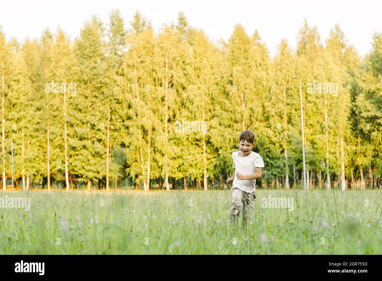 Boy runs across street hi-res stock photography and images - Alamy
