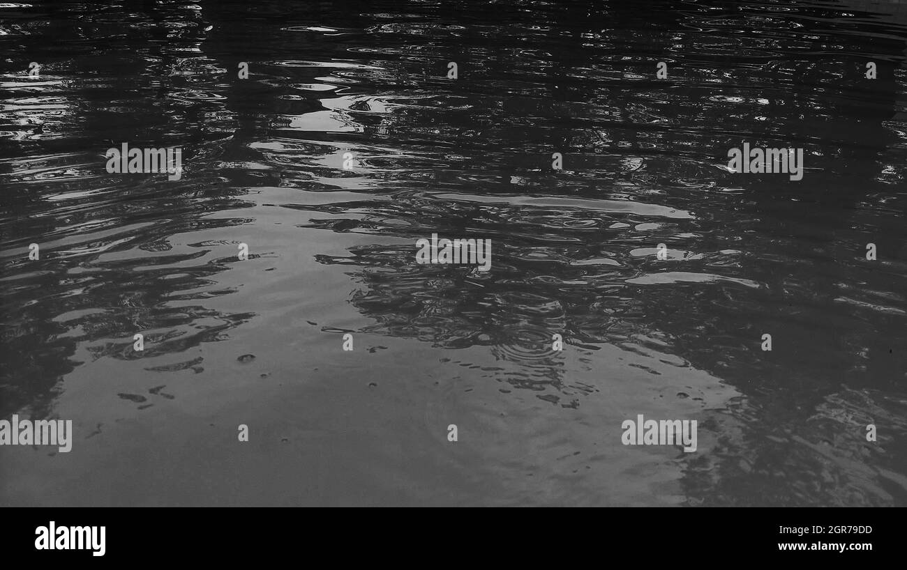 Black water surface. dark water texture background Stock Photo - Alamy