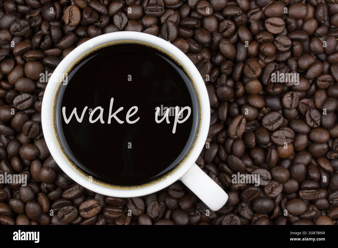 Wake Up Text In Coffee Cup On Coffee Beans Background Stock Photo - Alamy