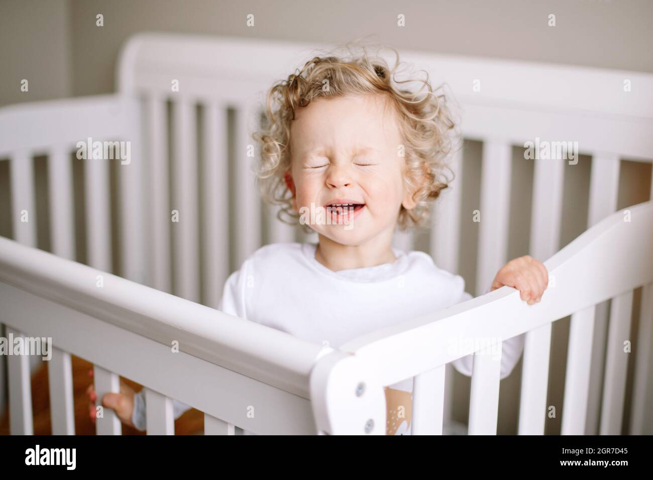 Baby Boy Crying In Crib At Home High Resolution Stock Photography and ...