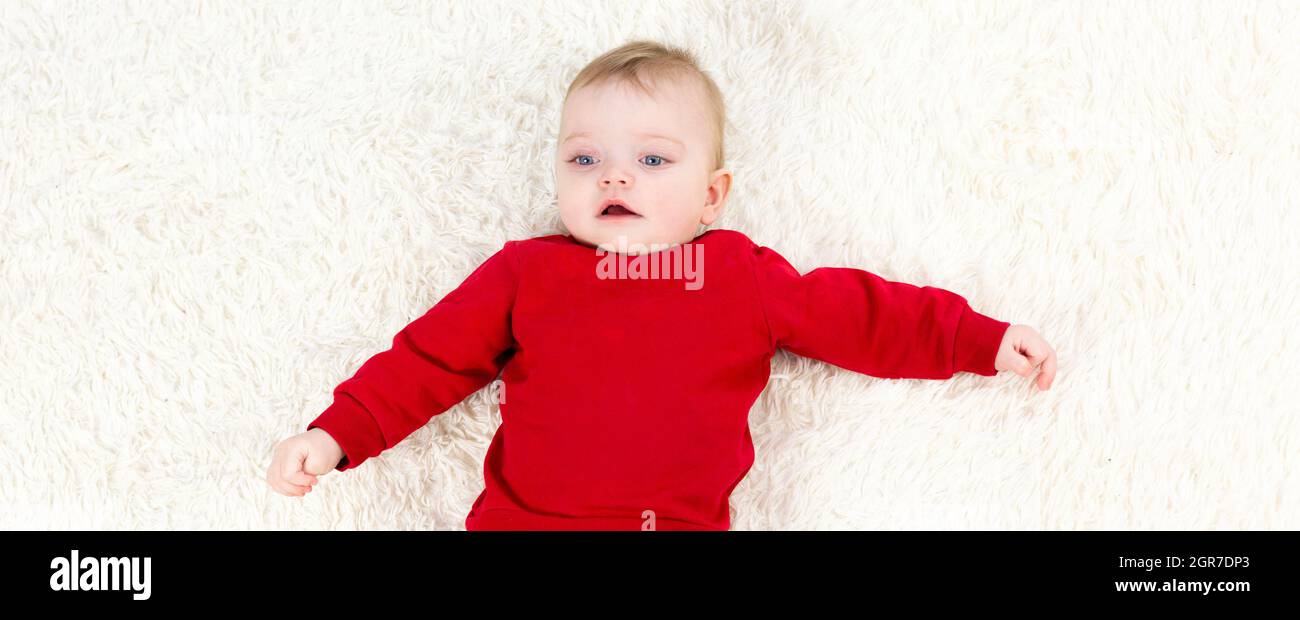 Baby in red hi-res stock photography and images - Alamy
